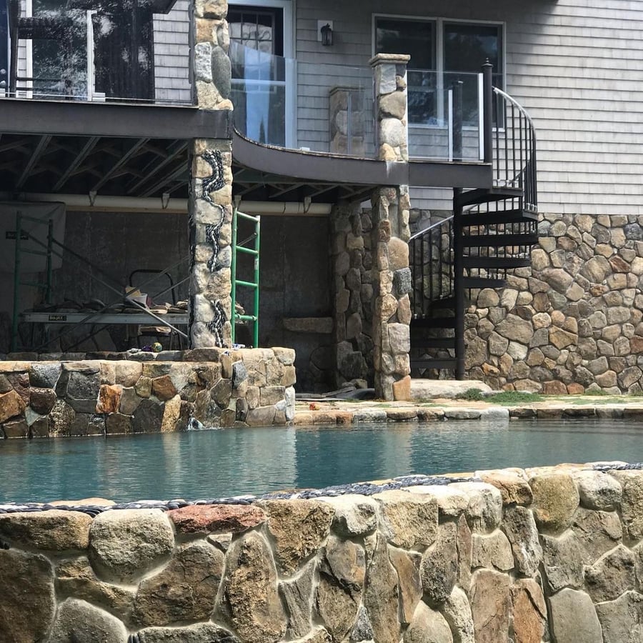 Stone Trend of the Summer: Spillover Spas and Stunning Pools